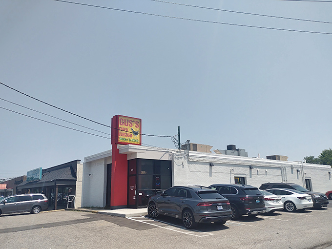 The unassuming exterior of Gus's hides culinary greatness like Clark Kent's glasses hide Superman. This modest building houses fried chicken royalty.