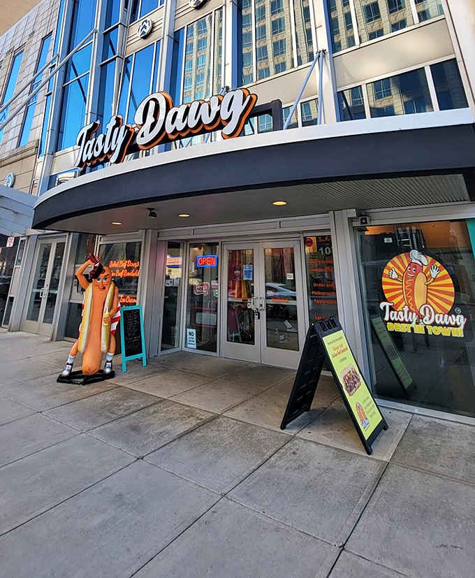 The hot dog mascot standing guard outside Tasty Dawg is like Columbus's unofficial greeter, welcoming hungry souls to hot dog paradise.