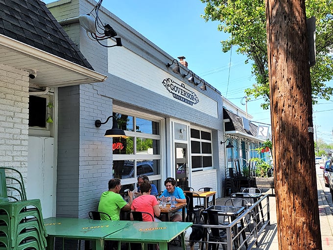 Sun-drenched sidewalk dining where conversations flow as freely as the coffee, proving some of life's best moments happen at small tables.
