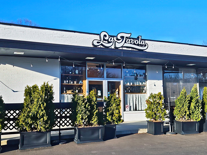 La Tavola's unassuming white exterior hides culinary treasures within, like finding a Fellini film playing at your local mall theater.