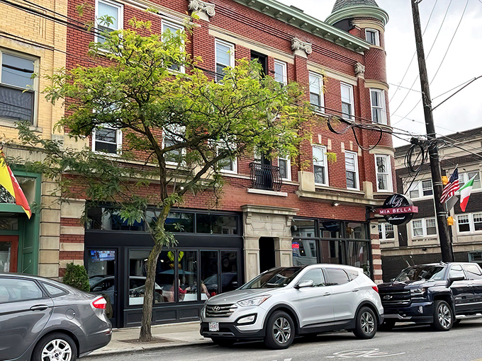 Mia Bella's classic brick exterior in Little Italy stands like a culinary lighthouse, beckoning hungry travelers with promises of authentic Italian delights within.