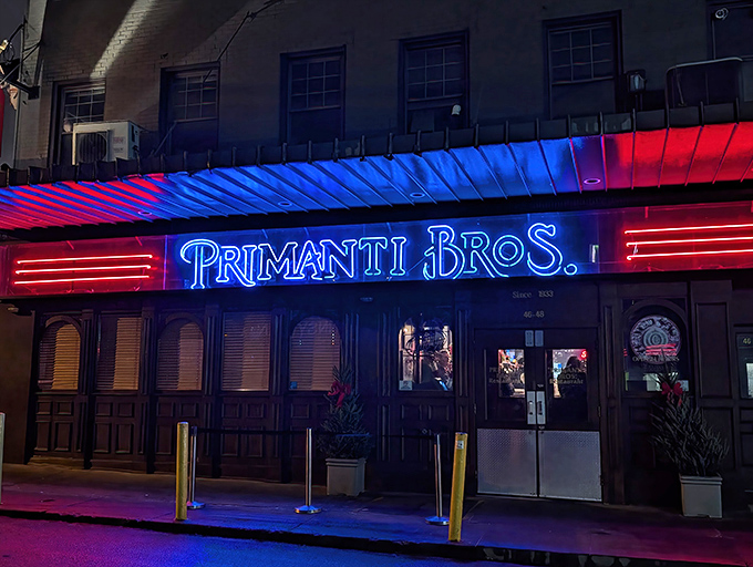 The neon glow of Primanti Bros. beckons hungry night owls like a culinary lighthouse in Pittsburgh's Strip District. Food paradise awaits.