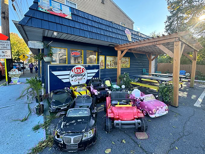 The fleet of toy cars greeting visitors at Dad's Garage isn't just adorable&mdash;it's the perfect preview of the playful automotive theme waiting inside.