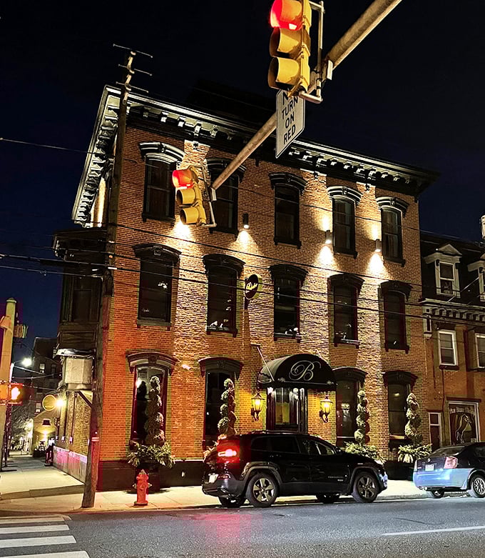 The Belvedere Inn glows like a Victorian beacon at night, its brick fa&ccedil;ade illuminated to welcome hungry Lancaster diners.