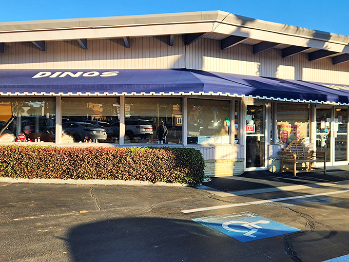 The blue awning of Dino's beckons like a breakfast lighthouse, guiding hungry souls to pancake paradise on North Myrtle Beach's bustling strip.