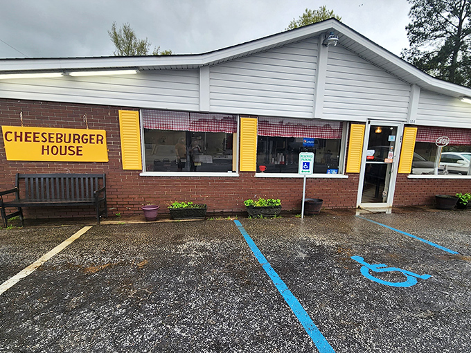 The unassuming exterior of Johnny's Cheeseburger House proves once again that culinary treasures often hide behind modest facades. Yellow shutters hint at the golden delights within.