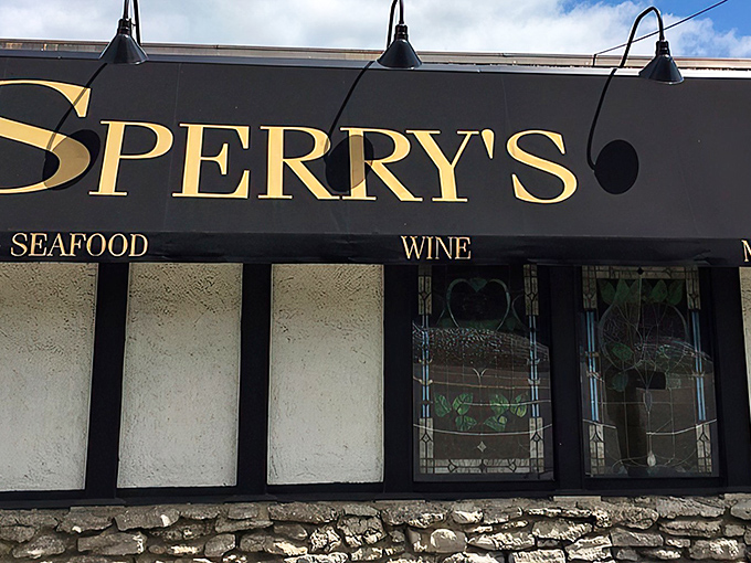 The iconic black and gold signage of Sperry's promises understated elegance – like a perfectly tailored tuxedo that never goes out of style.