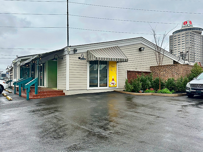 The unassuming exterior of Half Shell beckons with its "Sunday Brunch" sign, proving that seafood treasures often hide in the most modest packages.