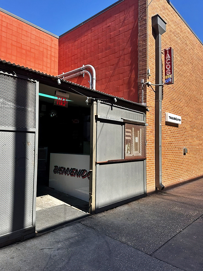 The no-frills entrance might not win architectural awards, but it's a portal to flavor country that locals guard like a secret family recipe.