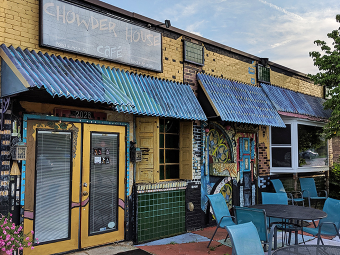 The yellow brick exterior with vibrant blue awnings feels like stumbling upon a secret coastal gem that somehow landed in Akron's Merriman Valley.