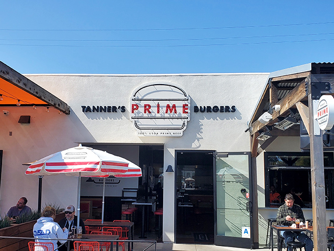 The white facade with that bold red "PRIME" sign isn't just a restaurant entrance&mdash;it's a portal to burger nirvana in sunny Oceanside.
