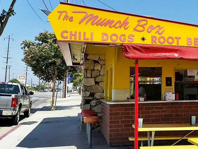 The sunshine-yellow landmark stands proudly with its iconic arrow sign, a time capsule of 1950s Americana serving up nostalgia and deliciousness in equal measure.