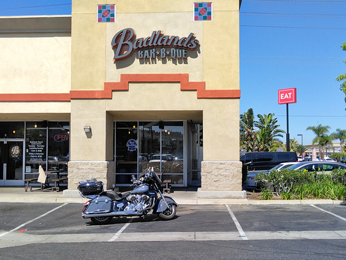 Unassuming strip mall exterior by day, barbecue paradise by night. The best culinary treasures often hide in plain sight.