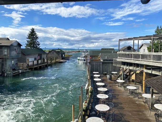 Where water meets whimsy! The Cove's deck offers front-row seats to Leland's aquatic highway, where boats parade and appetites awaken.