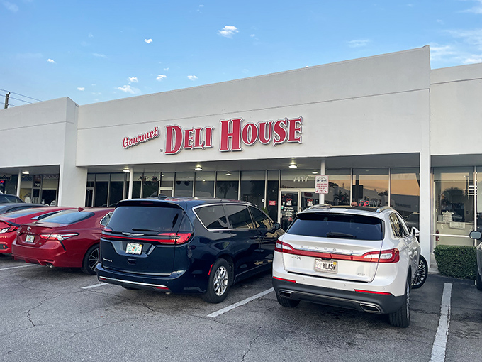 The kind of storefront that whispers "serious sandwiches inside" while the parking lot practically screams customer approval.