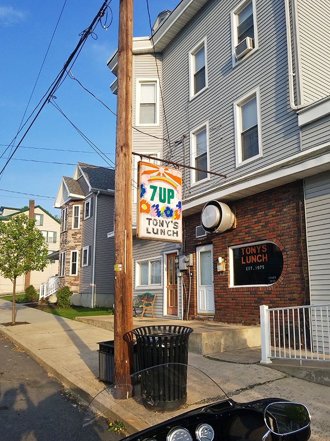 The vintage 7UP sign glows like a beacon of burger hope on this unassuming Girardville street corner. Culinary treasures often hide in plain sight.