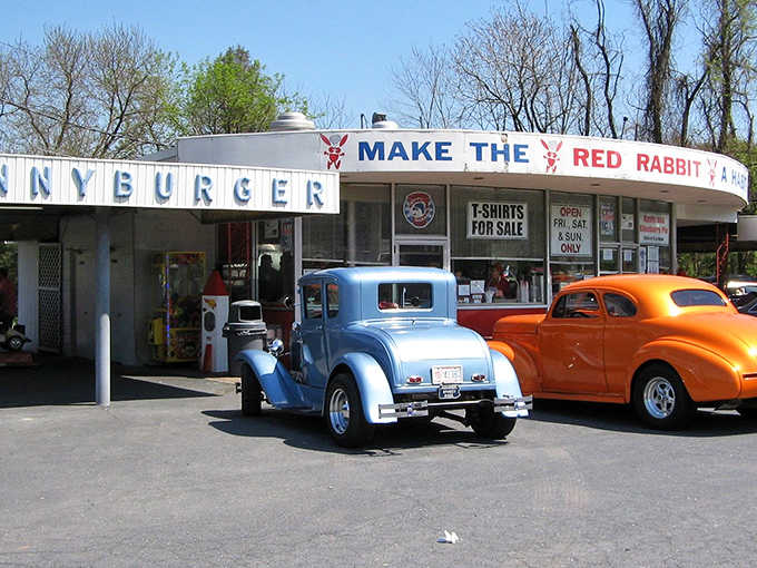 The iconic Red Rabbit Drive-In stands like a time capsule of Americana, complete with vintage cars that seem to have driven straight out of a '50s postcard.