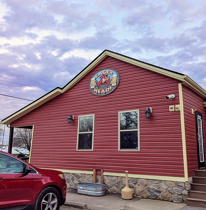 That iconic red siding and playful logo tell you everything you need to know: serious barbecue happens here, no fancy frills required.