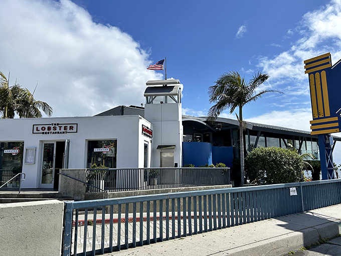The Lobster stands proudly at the entrance to Santa Monica Pier, its white exterior and American flag promising seafood treasures within. No pretension, just ocean-fresh possibilities. 