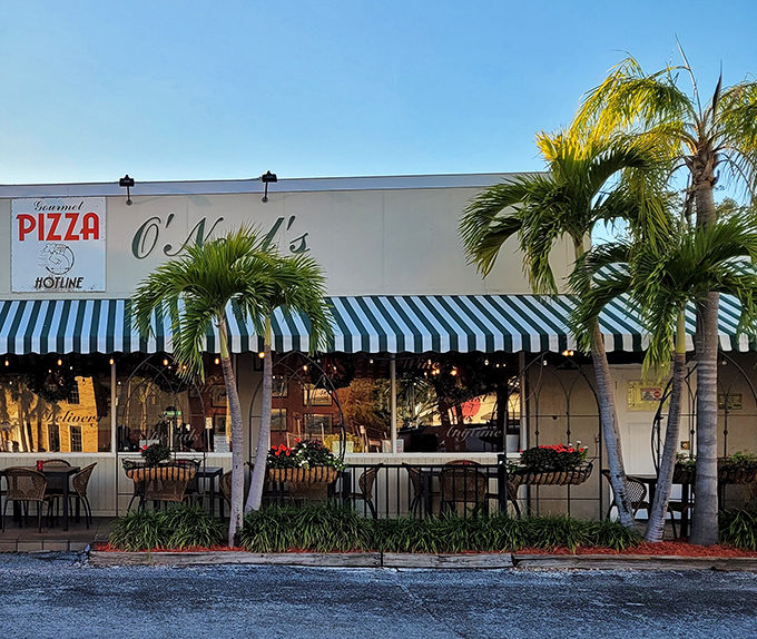 The iconic blue and white striped awnings of Sally O'Neal's welcome you like an old friend who happens to make incredible pizza.