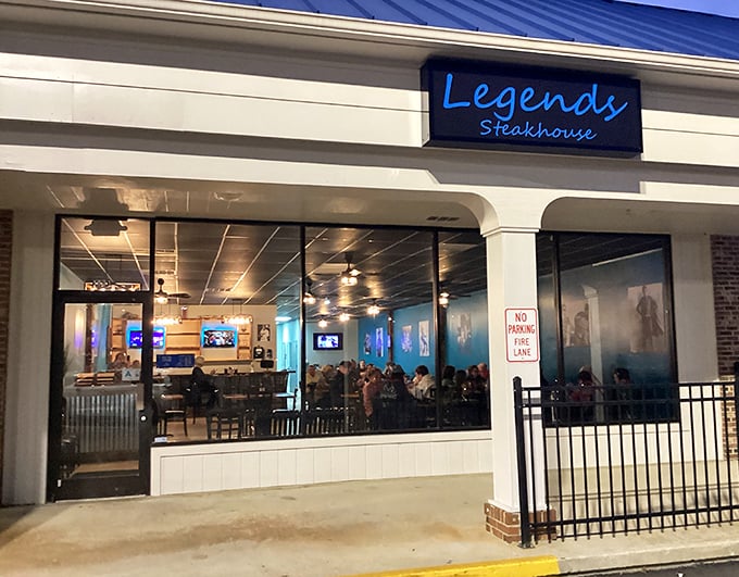 Evening at Legends transforms this modest storefront into a beacon for hungry souls. The blue glow through the windows whispers, "Yes, this is the place."