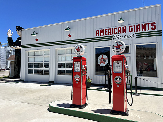 The American Giants Museum stands proudly in Atlanta, Illinois, where vintage gas pumps and a waving policeman giant welcome roadtrippers to this Route 66 treasure.