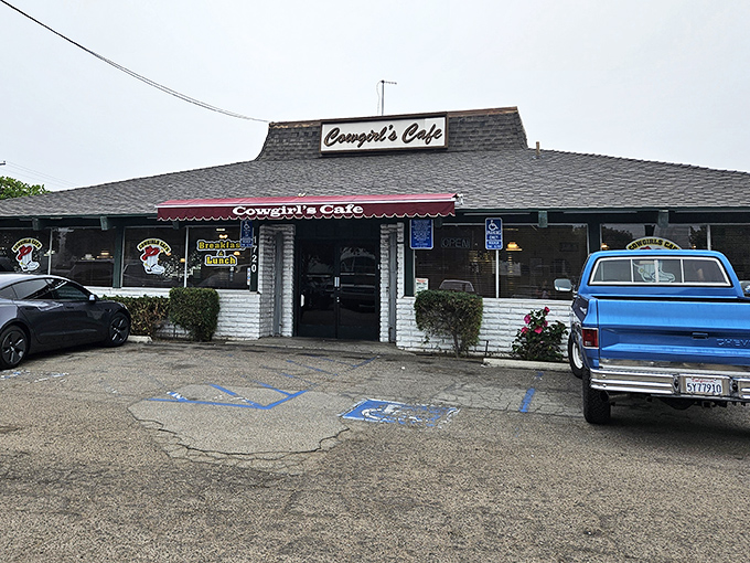 A vintage blue pickup truck parked outside perfectly complements the rustic charm of this beloved Santa Ana breakfast institution.