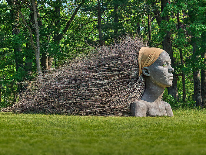 Like a modern-day Medusa who turned twigs instead of men to stone, this breathtaking sculpture captures nature's wild spirit flowing through human form.