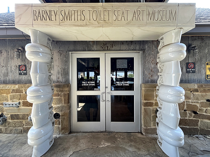 The entrance to Barney Smith's Toilet Seat Art Museum welcomes you with columns made of&mdash;what else?&mdash;stacked toilet seats!