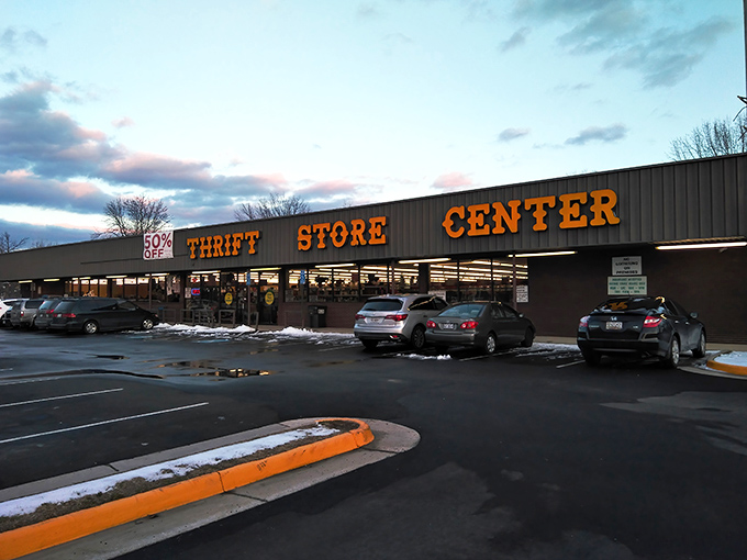 The orange glow of Prime Thrift's signage beckons like a lighthouse for bargain hunters, promising treasures within those unassuming walls.