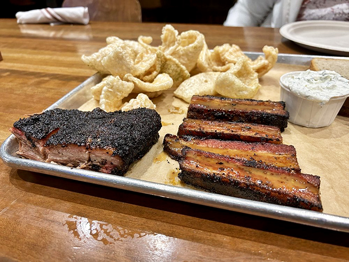 A meat duet that deserves a standing ovation. The brisket and ribs perform a smoky symphony on this metal stage.