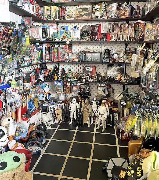 A Star Wars collector's fever dream comes to life in this booth, where the Force is strong with vintage action figures and memorabilia.