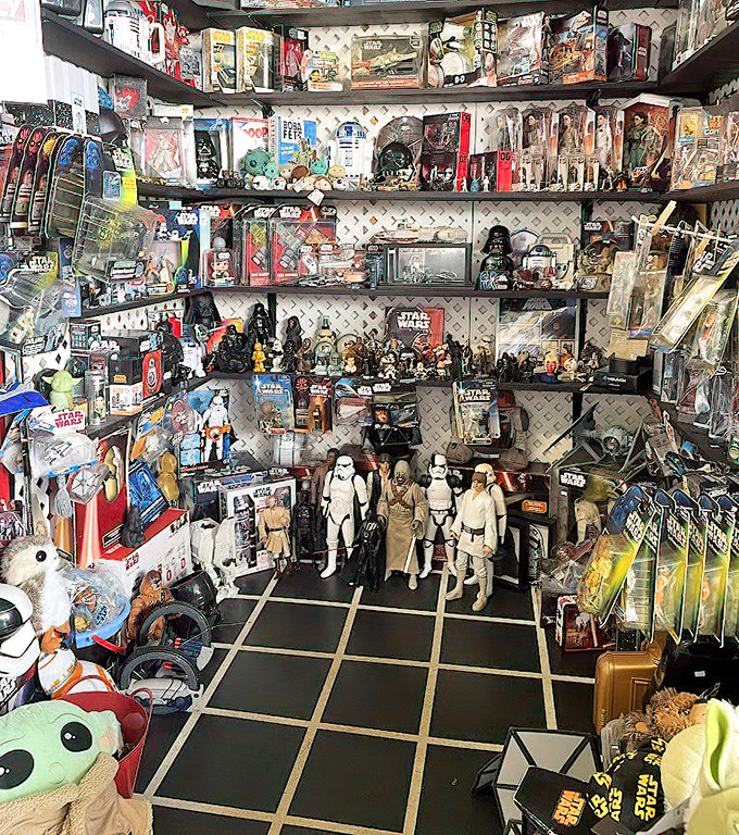 A Star Wars collector's fever dream comes to life in this booth, where the Force is strong with vintage action figures and memorabilia.