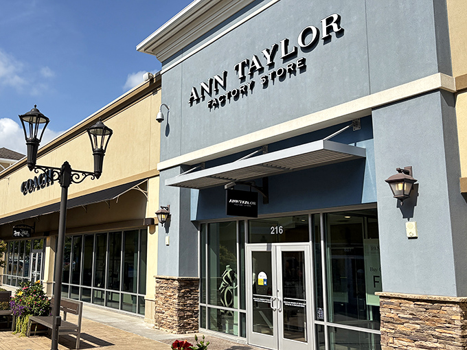 Ann Taylor Factory Store's elegant blue façade stands out among the earth tones – sophisticated style meets mountain sensibility.