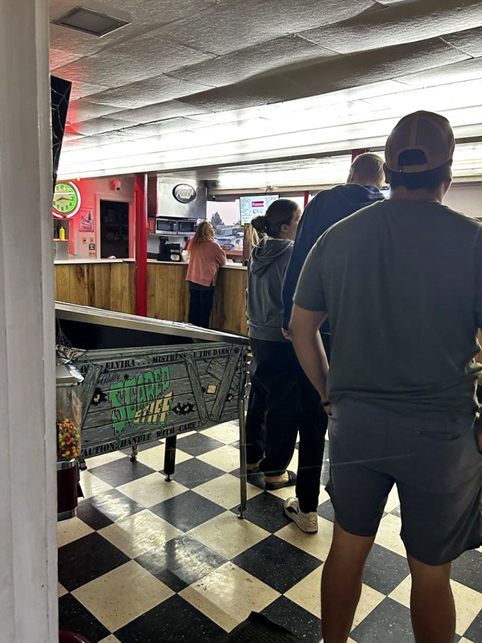 Families and friends gather for the pre-show ritual of securing provisions for their automotive adventure.