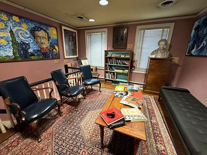 Rich burgundy walls frame literary treasures while comfortable seating invites quiet contemplation of poetic genius.