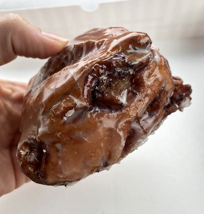 The apple fritter &ndash; that magnificent, misshapen marvel where apple chunks hide in glazed nooks and crannies like sweet buried treasure.