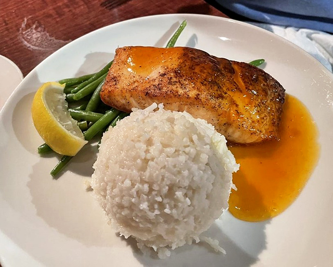 Apricot salmon that glistens like a sunset, paired with jasmine rice so perfect it could make a grain enthusiast write poetry.