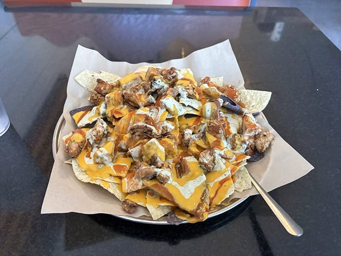 BBQ nachos&mdash;where Tex meets Mex meets NC. A glorious mountain of chips, cheese, and chopped meat that makes sharing both necessary and slightly heartbreaking.