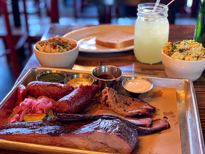 The barbecue sampler that makes decision-making obsolete. Why choose between brisket, ribs, and sausage when you can have the holy trinity on one tray?