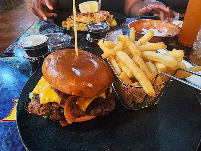 A burger so substantial it could have its own zip code. The cheese melt alone deserves a moment of silent appreciation.