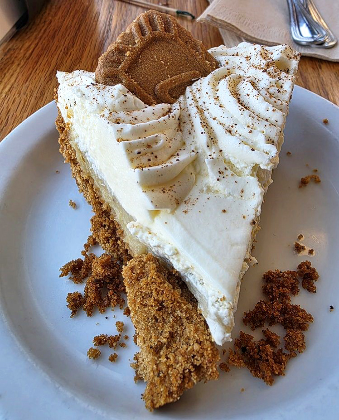 This slice of banana cream pie isn't just dessert; it's a cloud of sweet comfort with a graham cracker foundation solid enough to support your dreams.