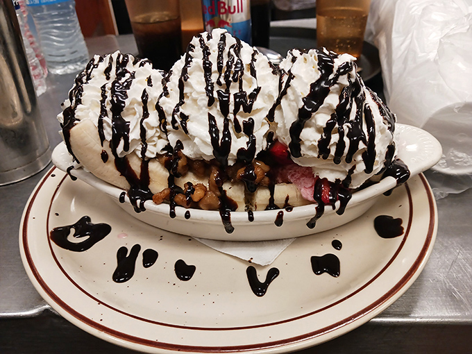 This banana split isn't just dessert, it's an architectural achievement of whipped cream, chocolate, and "I'll-just-have-one-more-bite" temptation.