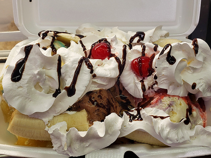 Behold the banana split—where restraint goes to die. This isn't dessert, it's a carnival of sweetness in a to-go container.