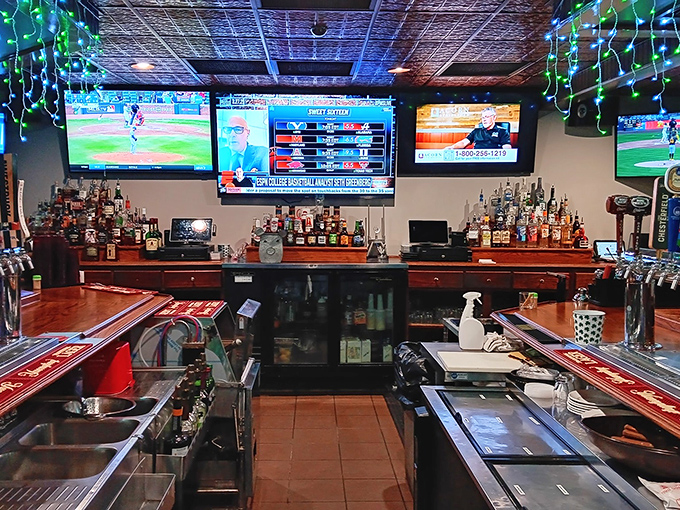 The bar isn't just serving drinks—it's providing the perfect liquid accompaniment to hours of smoking expertise. Sports on TV, spirits on shelves, satisfaction guaranteed.