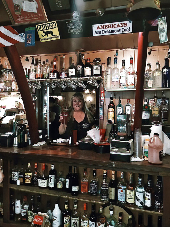 Behind the bar, bottles gleam like trophies, promising liquid courage for those brave enough to try the grill-your-own option.