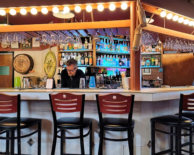 The bar beckons with string lights that sparkle brighter than a Hollywood premiere, but tastier.