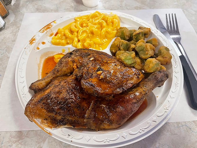 Barbecue chicken with that mahogany skin and tender meat, flanked by mac and cheese that glows like edible sunshine &ndash; Southern comfort on a plate.