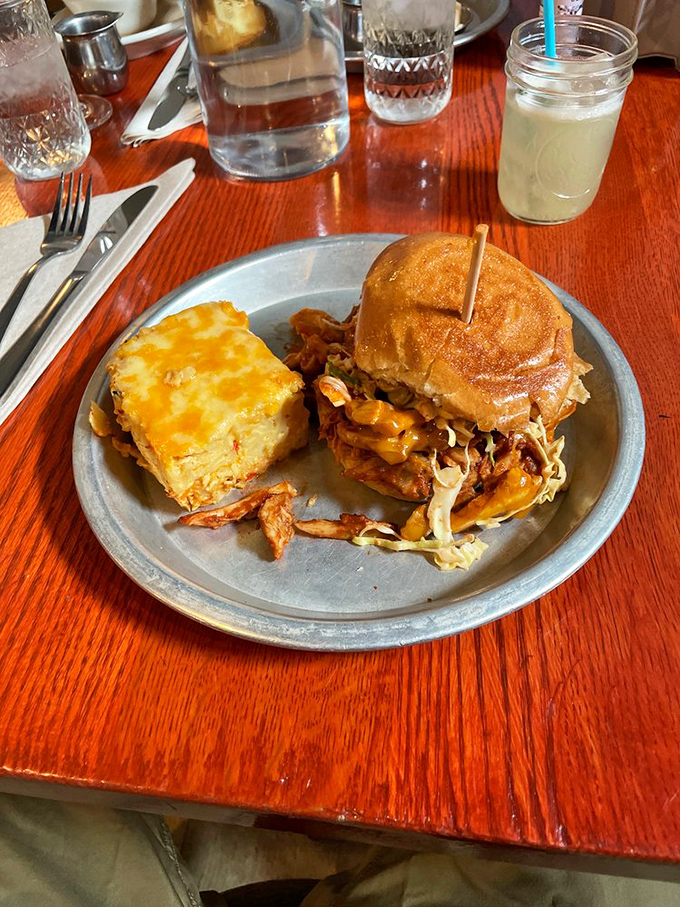 A sandwich that requires both hands and several napkins, paired with cornbread that deserves its own fan club.