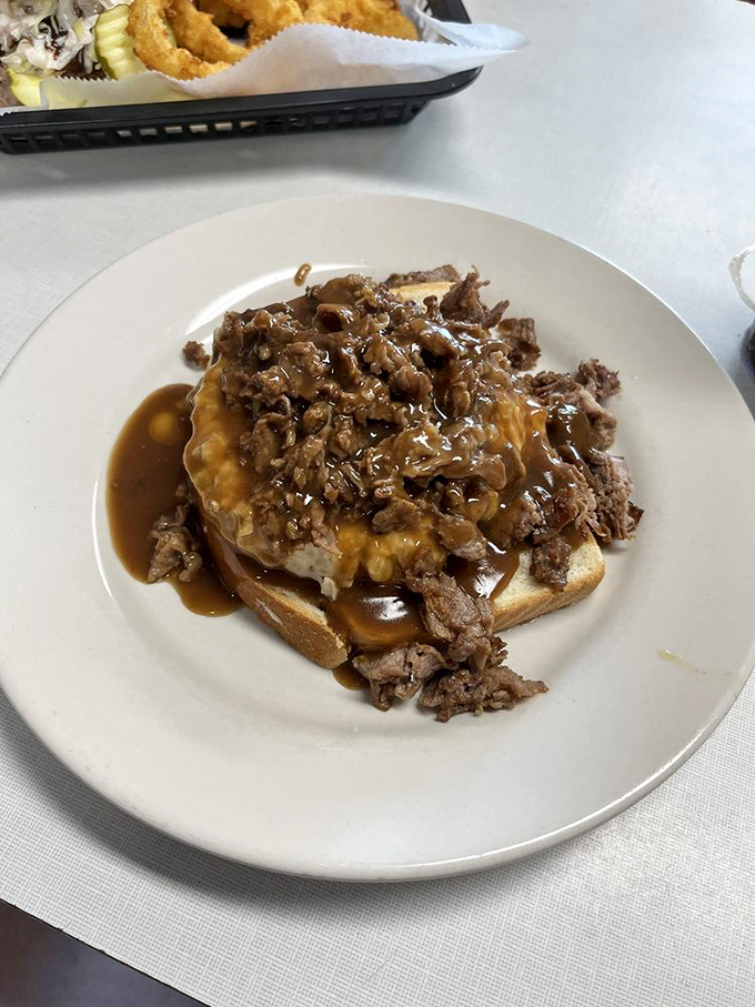 The legendary Beef Manhattan&mdash;open-faced, gravy-drenched comfort that makes you wonder why plates weren't designed square-shaped from the beginning.